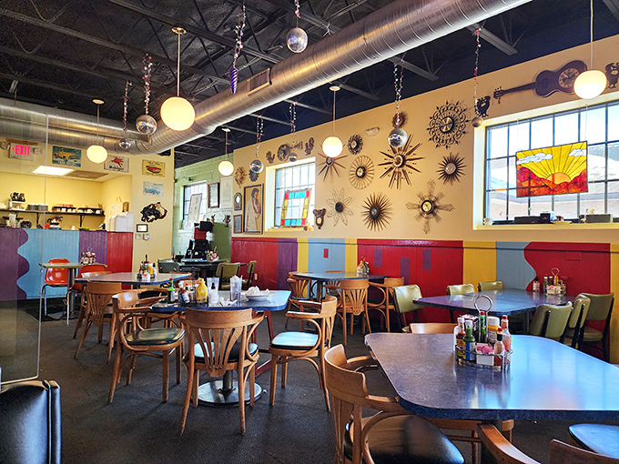 Step inside and the cosmic explosion of colors, sunburst clocks, and disco balls tells you this isn't your average greasy spoon. The retro-futuristic vibe sets the perfect stage for culinary liftoff.