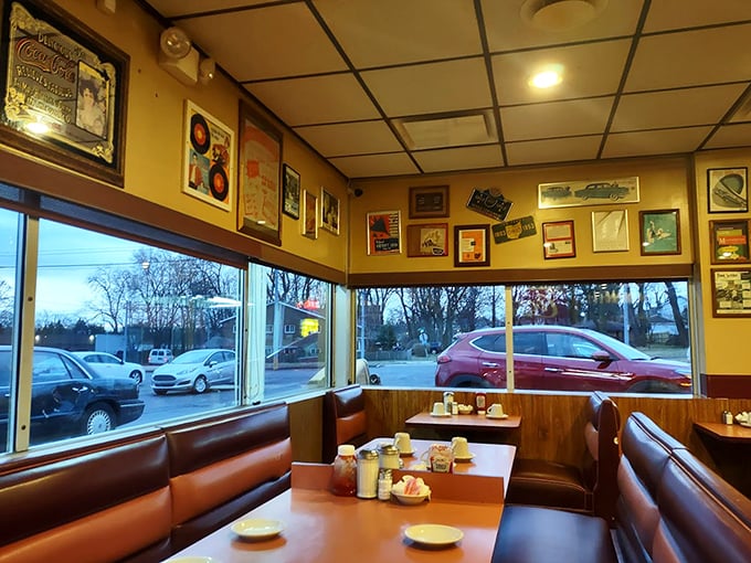 Classic diner booths bathed in golden light, where vinyl seats have cradled generations of Dayton breakfast enthusiasts.