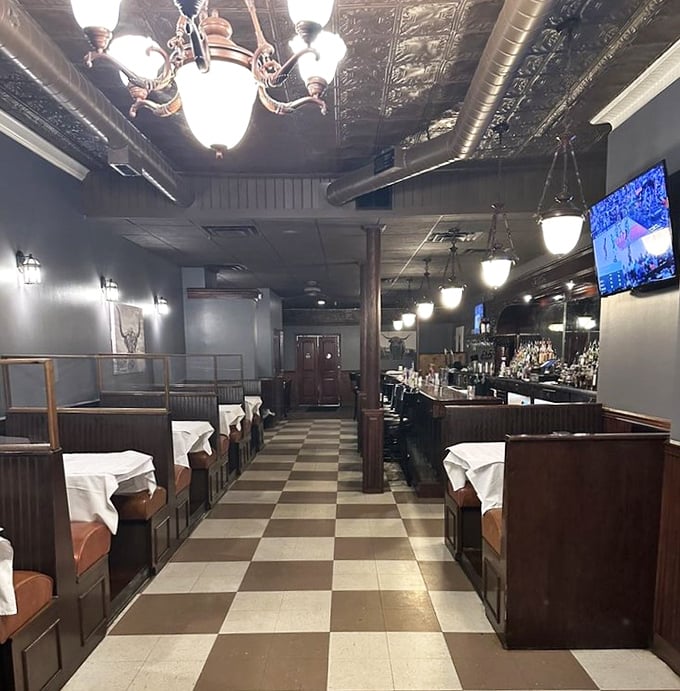 Classic checkerboard floors and pressed tin ceilings transport you to a time when dinner was an event, not just a pit stop between Netflix episodes.