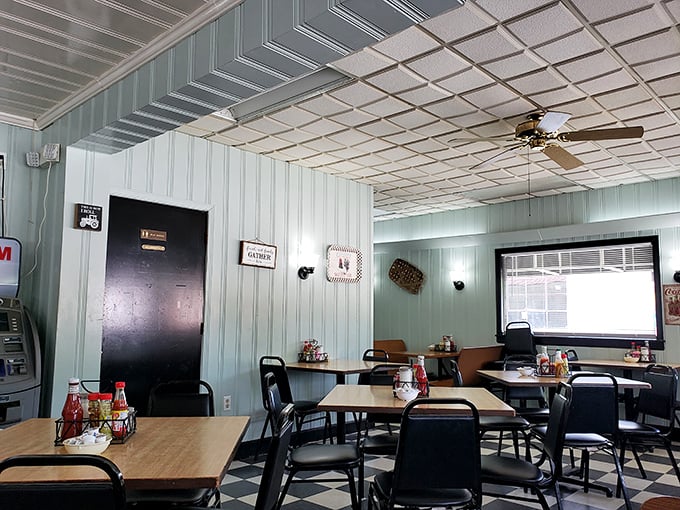 Inside, mint-green walls and checkered floors create that timeless diner atmosphere where conversations flow as freely as the coffee.