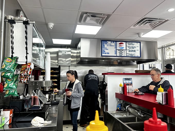Inside Powers, the kitchen ballet unfolds before your eyes—spatulas flying, onions sizzling, and hungry patrons perched at the counter watching the magic happen.