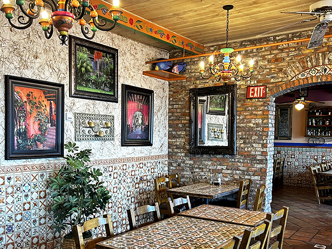 Exposed brick meets colorful tile work in this dining room that feels like your favorite aunt's house in Mexico—if your aunt had impeccable taste in folk art.