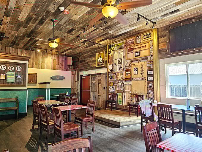 Step inside and the rustic wood-paneled interior feels like the living room of that friend who always throws the best backyard cookouts.