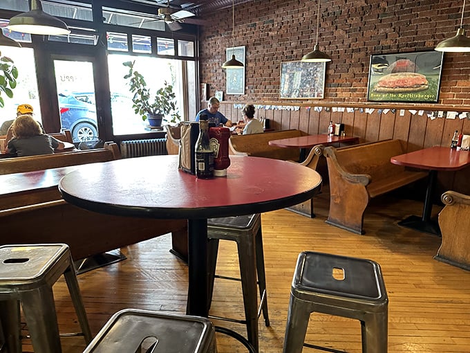 Exposed brick walls and wooden booths create that perfect "been-here-forever" vibe. This isn't interior design—it's sandwich authenticity in architectural form.