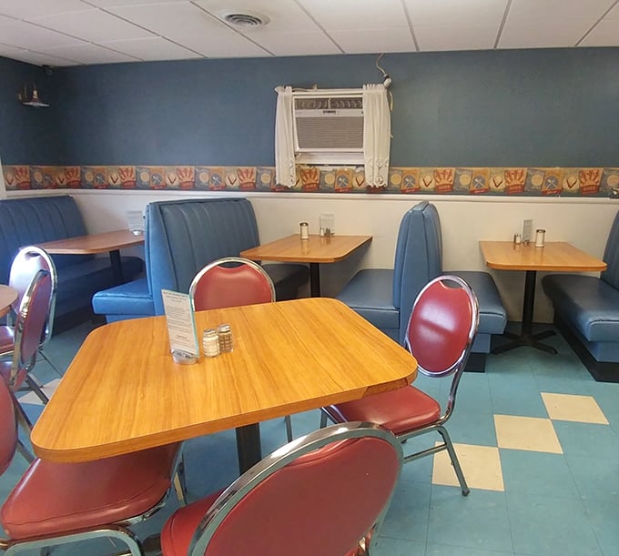 Classic blue vinyl booths and retro chairs create that perfect "time stood still" atmosphere where conversations flow as freely as the coffee.