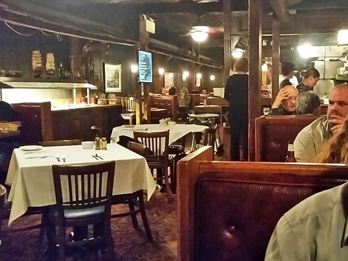 Inside, wood-paneled walls and cozy booths create the feeling you've stepped into a captain's quarters where seafood stories are served alongside stellar cuisine.