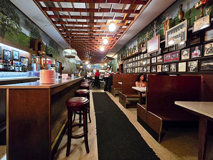 Step inside and time stands still—wooden booths, memorabilia-lined walls, and that distinctive latticed ceiling create the perfect backdrop for pizza pilgrimage.