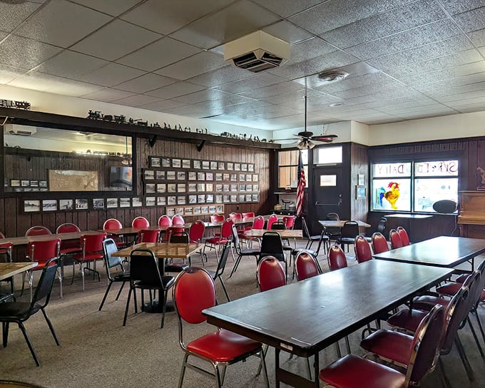 Red vinyl chairs and wood-paneled walls tell stories of decades past, creating the kind of authentic atmosphere that chain restaurants spend millions trying to replicate.