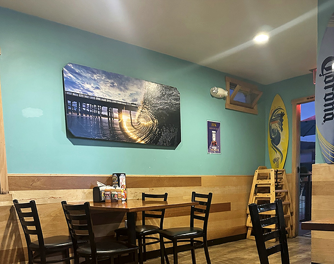 Ocean vibes wash over you inside with surfboards, wave photography, and that distinctive coastal blue that makes you feel the sea breeze even before your first bite.