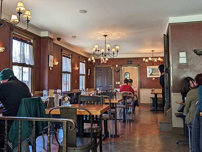 Inside, warm wood tones and soft lighting create the perfect backdrop for breakfast epiphanies. Chandeliers add just enough elegance without sacrificing comfort.