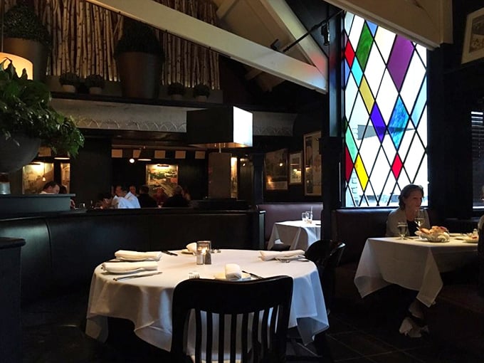Those stained glass windows aren't just for show—they transform ordinary dinners into Technicolor celebrations while keeping conversations intimate.