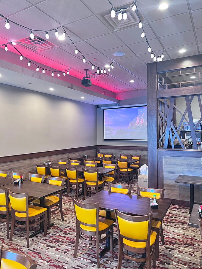 Cheerful yellow chairs and string lights create an atmosphere that's both upscale and welcoming—like your fancy friend who still loves pizza rolls.