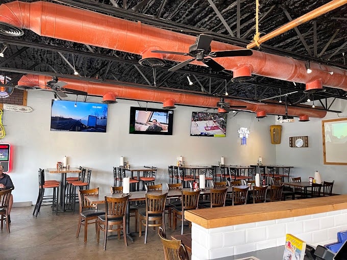 Industrial chic meets seafood shack inside, where orange ductwork and wooden chairs create the perfect backdrop for serious eating.