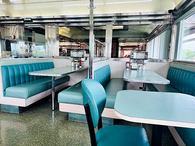 Those turquoise vinyl booths aren't trying to be retro—they're the real deal. Sliding into one feels like joining a secret society of comfort food connoisseurs.