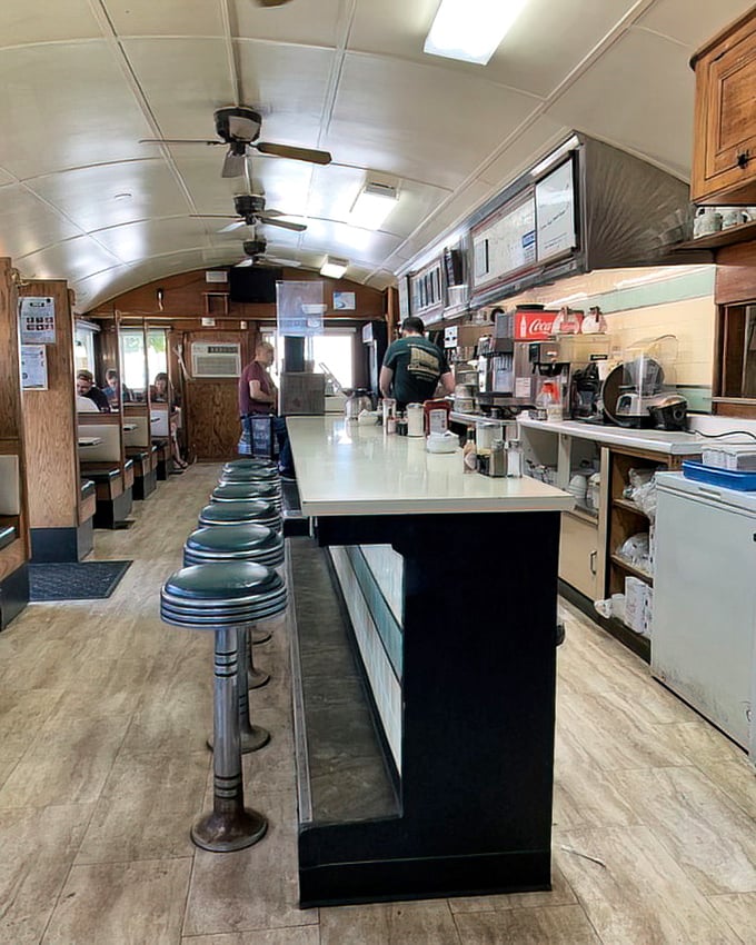 Classic Americana preserved in chrome and vinyl—where the curved ceiling, counter stools, and wood paneling create the perfect backdrop for breakfast epiphanies.