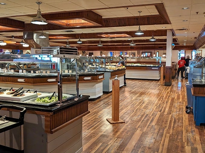 Polished wood floors and well-organized serving stations create an inviting atmosphere where the serious business of buffet navigation becomes a delightful adventure.