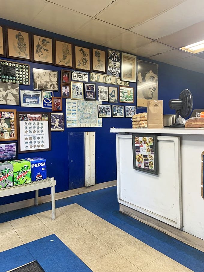 Baseball heaven meets sandwich central. The blue walls serve as a shrine to America's pastime, creating the perfect backdrop for your lunchtime pilgrimage.