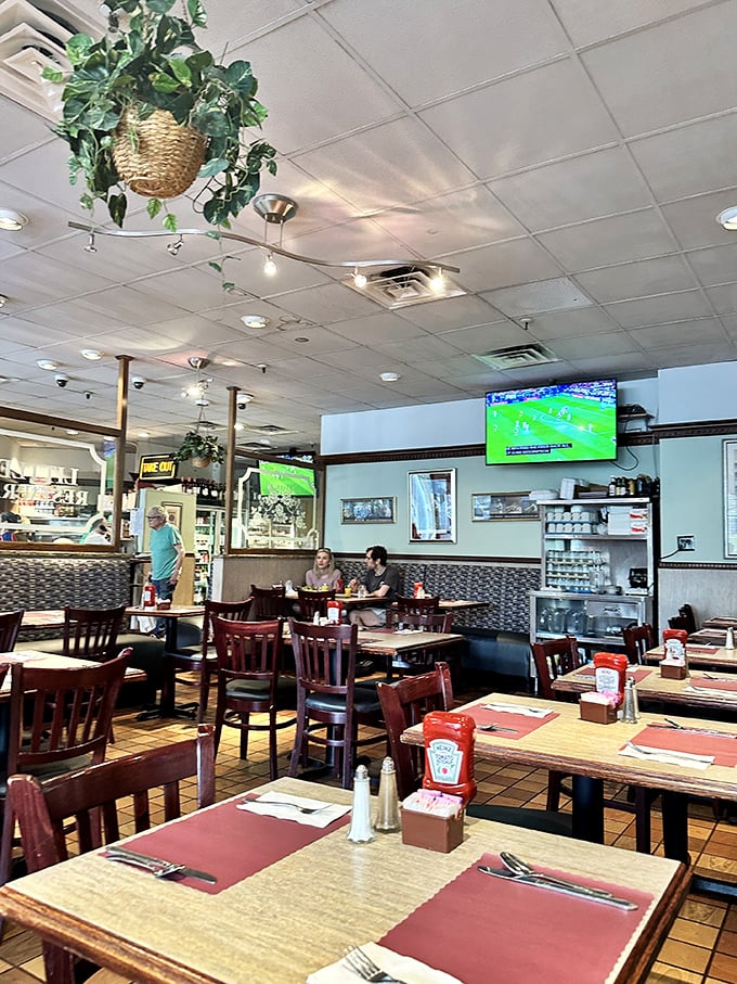 Inside, hanging plants soften the classic diner aesthetic while TVs broadcast the game – that perfect blend of homey and happening.