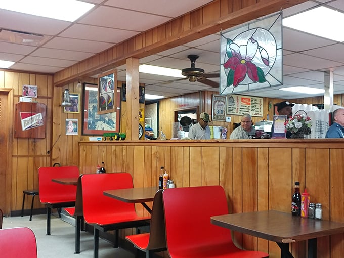 Step inside and be transported to a simpler time, where wood paneling and red chairs aren't retro by design—they're just authentically themselves.