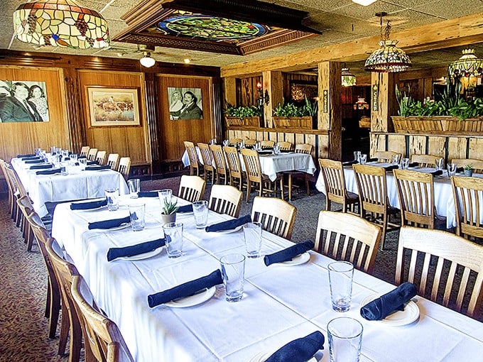 Stained glass chandeliers and wood-paneled walls create the perfect backdrop for serious steak business. Like walking into a carnivore's cathedral.