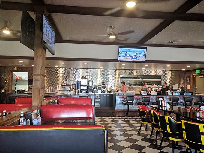 Red vinyl booths, checkered floors, and counter seating – the diner trifecta that signals you're about to experience something authentically American.
