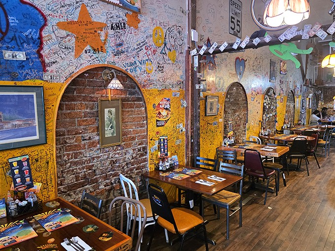 Step inside and you're greeted by walls covered in thousands of visitor signatures—a living guestbook that tells the story of countless satisfied appetites.