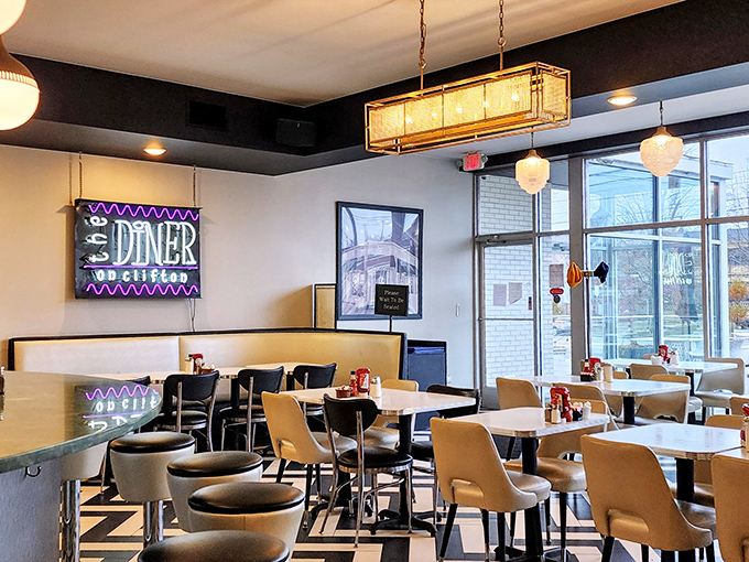 Inside, retro meets contemporary with that iconic neon sign, geometric flooring, and lighting that flatters both the food and your selfies.