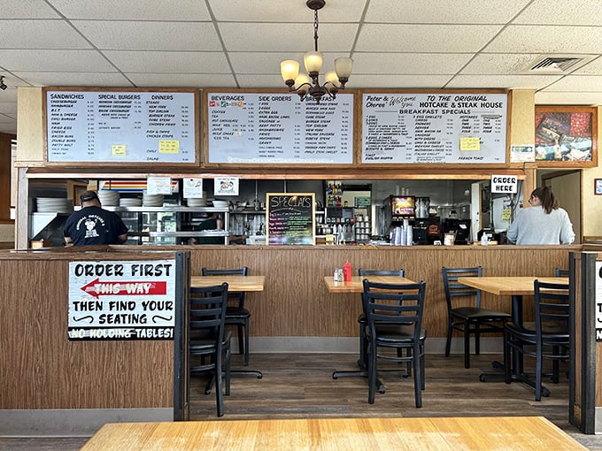 "ORDER FIRST, THEN FIND YOUR SEATING" - no-nonsense instructions that have kept this diner running smoothly since before smartphones replaced paper maps.