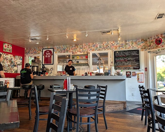 Where breakfast dreams come true – the postcard-covered walls tell stories of satisfied patrons while the counter beckons with promises of coffee refills.