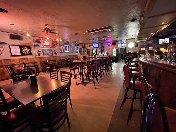 Cozy lighting, wood paneling, and neon beer signs—this is the kind of bar where stories stretch longer than the night.