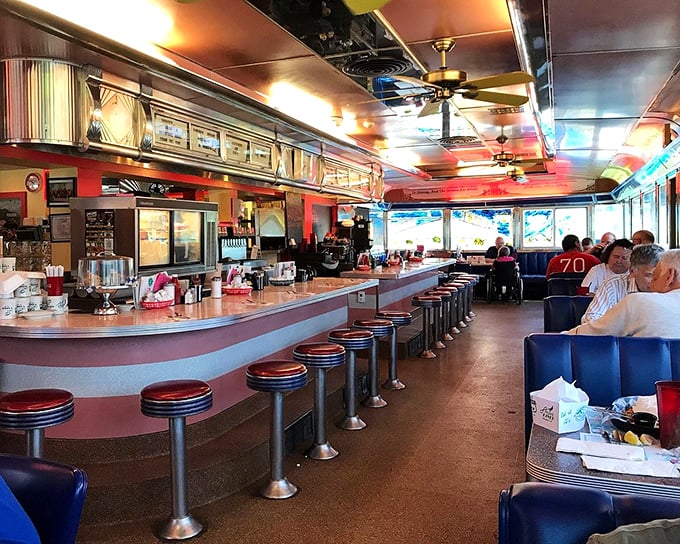 Counter seating at its finest—where you can watch culinary magic happen while perched on those iconic swivel stools that have supported hungry patrons for decades.
