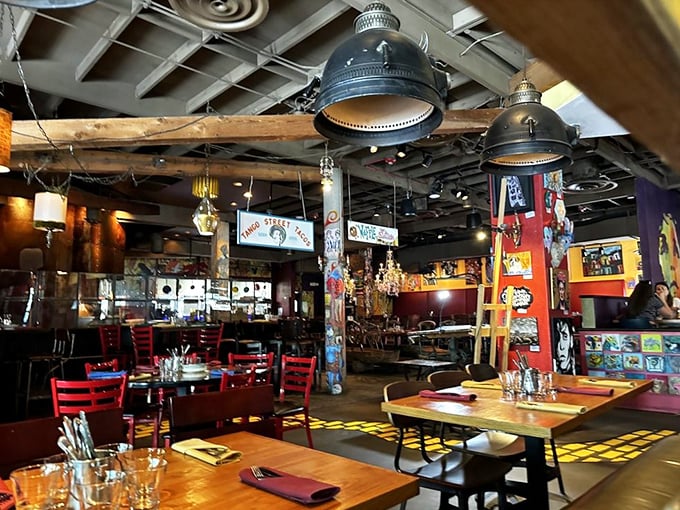 Inside, every inch tells a story. Wooden beams, eclectic lighting, and art-covered walls create a space where Salvador Dalí would feel right at home.