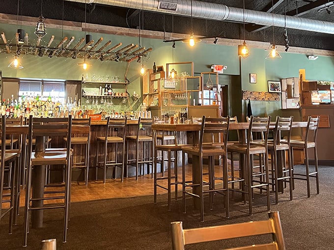 Edison bulbs cast a warm glow over the mint-green walls and wooden bar—like your coolest friend's living room, if your friend were an exceptional chef.