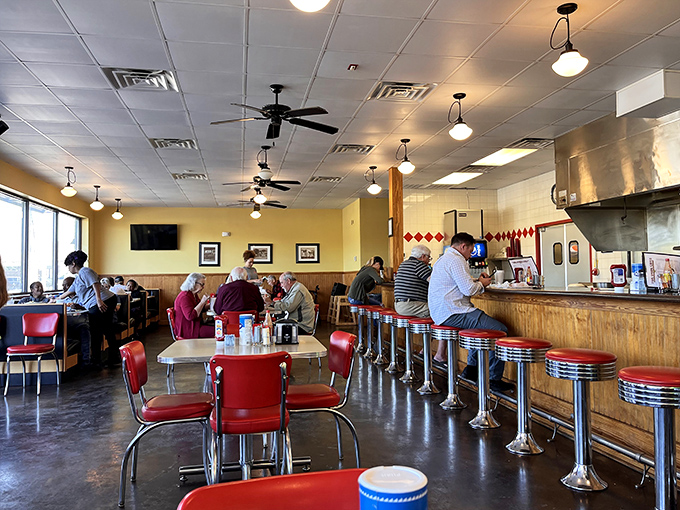 Classic Americana at its finest—chrome counter stools, ceiling fans, and conversations that matter. This isn't Instagram-bait; it's the real deal.
