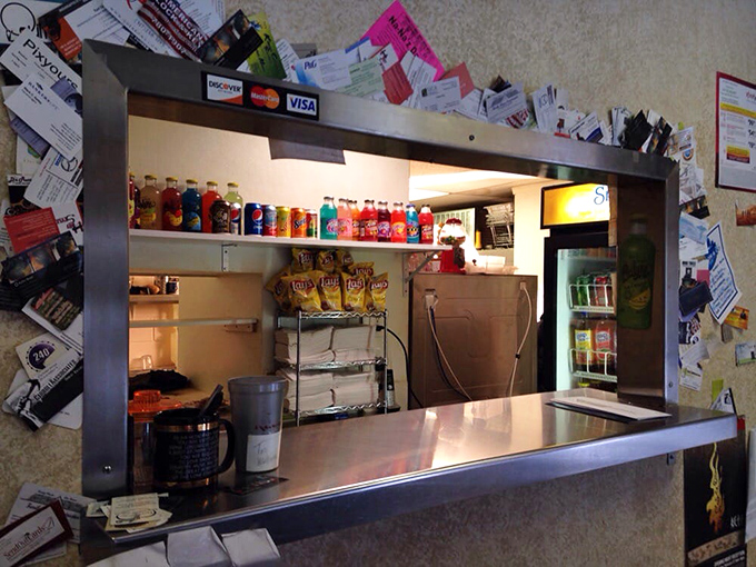The ordering window frames your destiny – and yes, that collage of papers is basically Indianapolis's version of the Sistine Chapel.