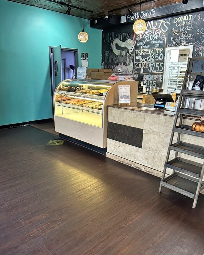 Inside, turquoise walls meet chalkboard menus in a space that prioritizes what matters most—showcasing those glorious donuts in their natural habitat.