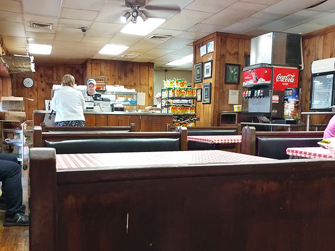 Wood paneling that would make a 1970s basement jealous creates the perfect backdrop for serious sandwich consumption and casual conversation.