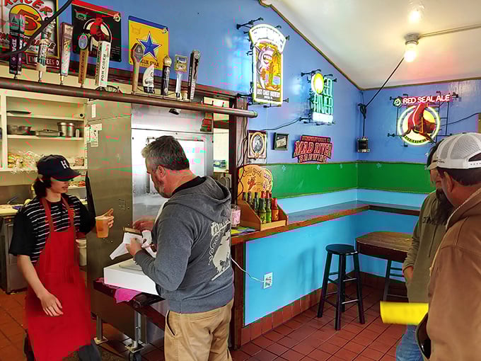 Vibrant blue walls and beer signs create the perfect backdrop for seafood magic. This isn't décor—it's a promise of coastal authenticity.