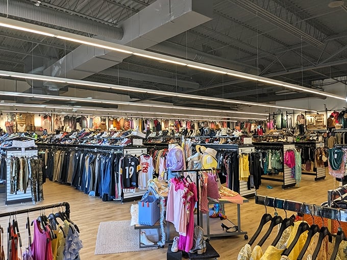Fashion democracy in action—rows upon rows of carefully organized clothing where designer labels mingle with everyday brands in a budget-friendly utopia.