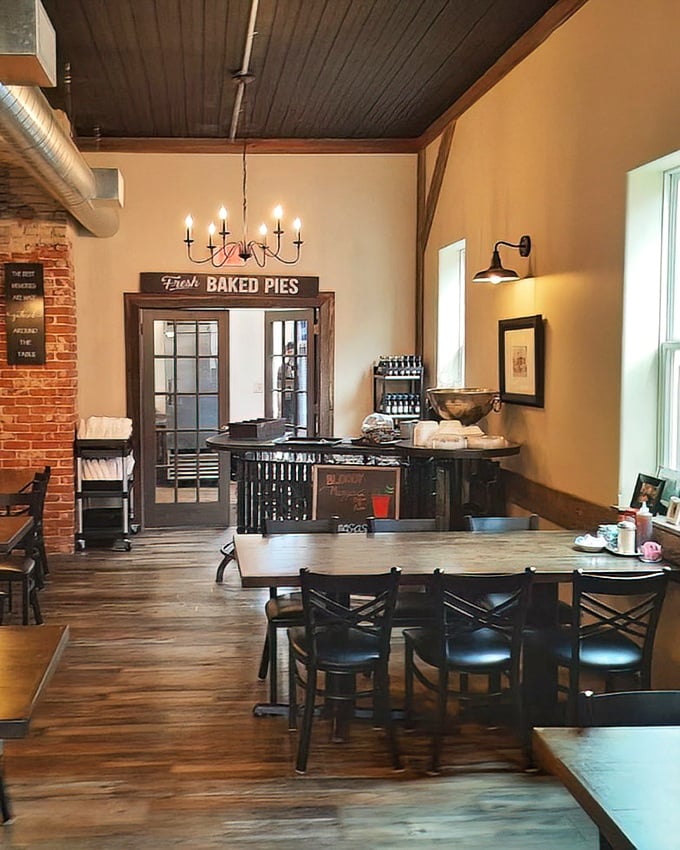 Inside, exposed brick meets wooden charm in a space that feels like Wisconsin's living room—complete with that "Fresh BAKED PIES" sign promising delicious things to come. 