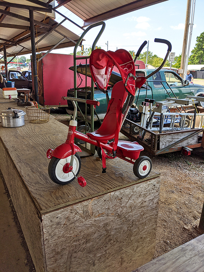 This cherry-red vintage tricycle isn't just transportation—it's childhood nostalgia on three wheels, waiting to become someone's conversation piece or a lucky kid's chariot.
