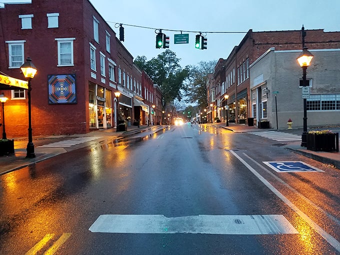 As dusk settles over Rogersville, the street lamps cast a golden glow that transforms ordinary brick into something magical, like a Norman Rockwell painting come to life.