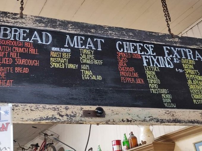 This chalkboard menu isn't just a list—it's a roadmap to sandwich nirvana. Choose your bread, meat, cheese, and "fixin's" to create your own masterpiece.