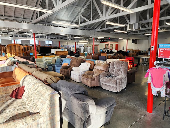 The sofa section resembles a living room showroom where every couch has a story and every recliner awaits its next nap enthusiast.