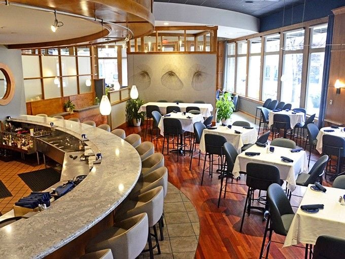 This curved bar isn't just seating—it's your front-row ticket to watching culinary artistry unfold before your eyes.