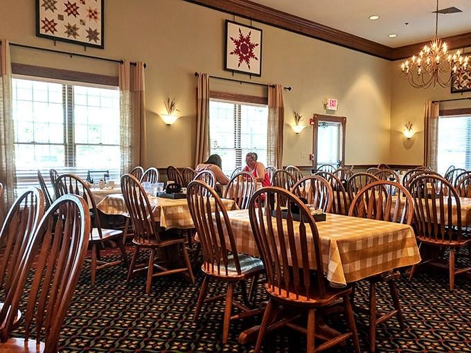 Step inside where quilted wall art and warm chandeliers create the perfect setting for serious comfort food conversations.