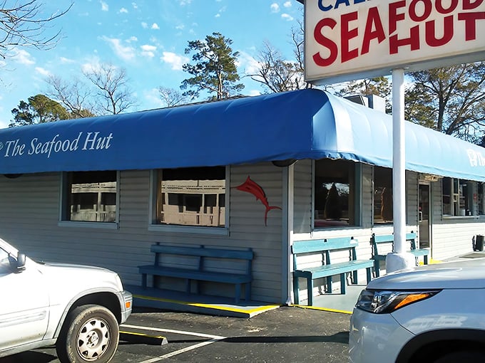 The Seafood Hut's humble blue exterior masks a kitchen that turns simple ingredients into golden magic.