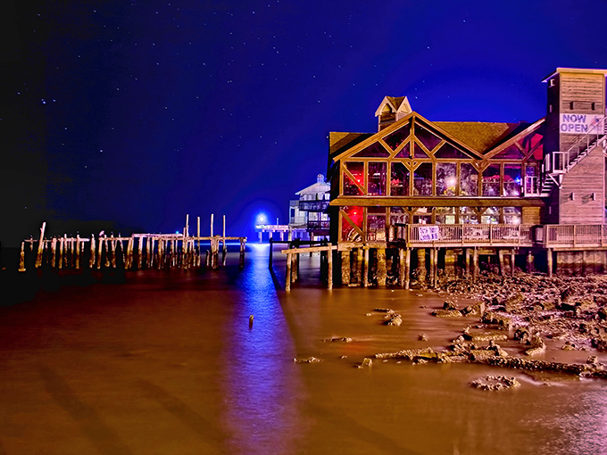 Cedar Key's weathered pier stretches into the Gulf like a wooden bridge to yesterday's simpler times.