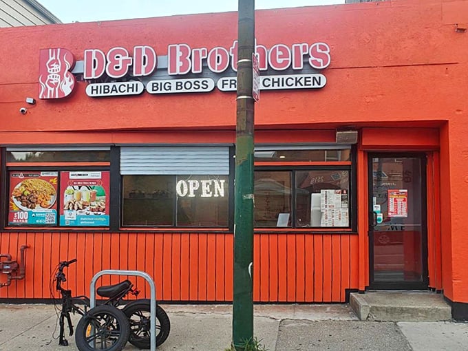 This vibrant orange storefront proves that great Korean fried chicken doesn't need subtlety – just serious flavor and artistic flair.