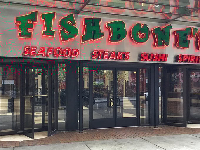 Neon promises of "seafood, steaks, sushi" – because why choose just one when you can have it all?